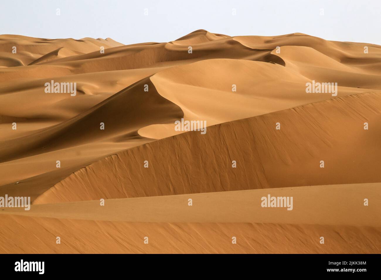 A beautiful view of the golden sand mounds on a beautiful sunny day at ...