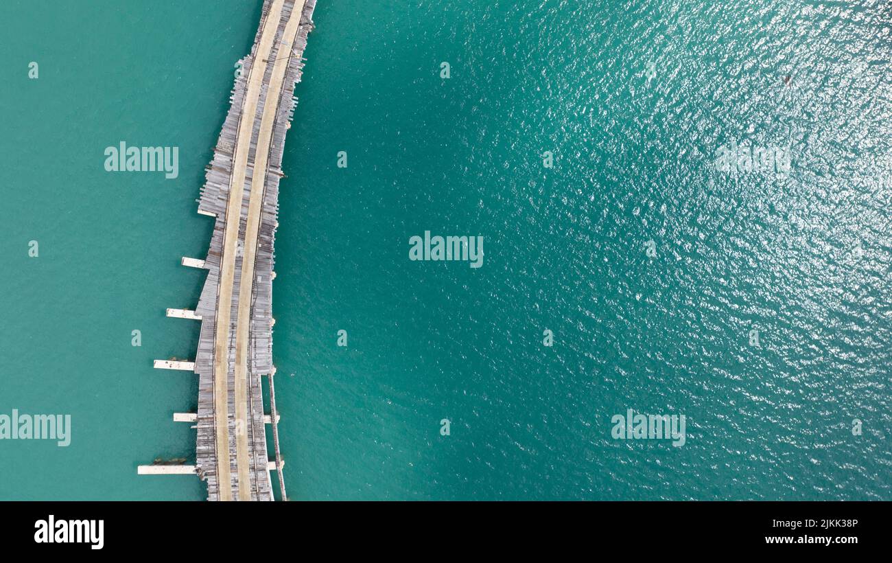 An aerial view of wooden pathway over the beautiful clear water Stock ...