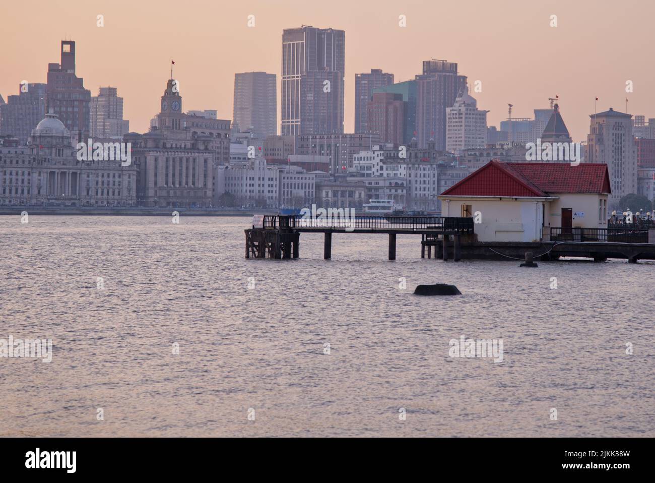 A beautiful shot at dawn time of the sea by the buildings of the city ...