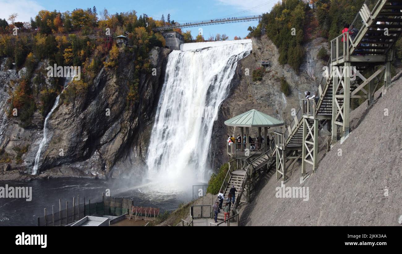 A beautiful shot of Canada Waterfalls with some tourists watching from ...