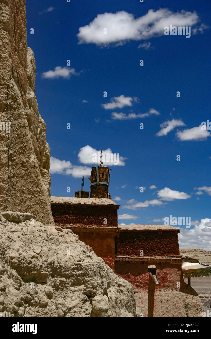 A beautiful side shot of rocky walls and cascade stone building with a ...