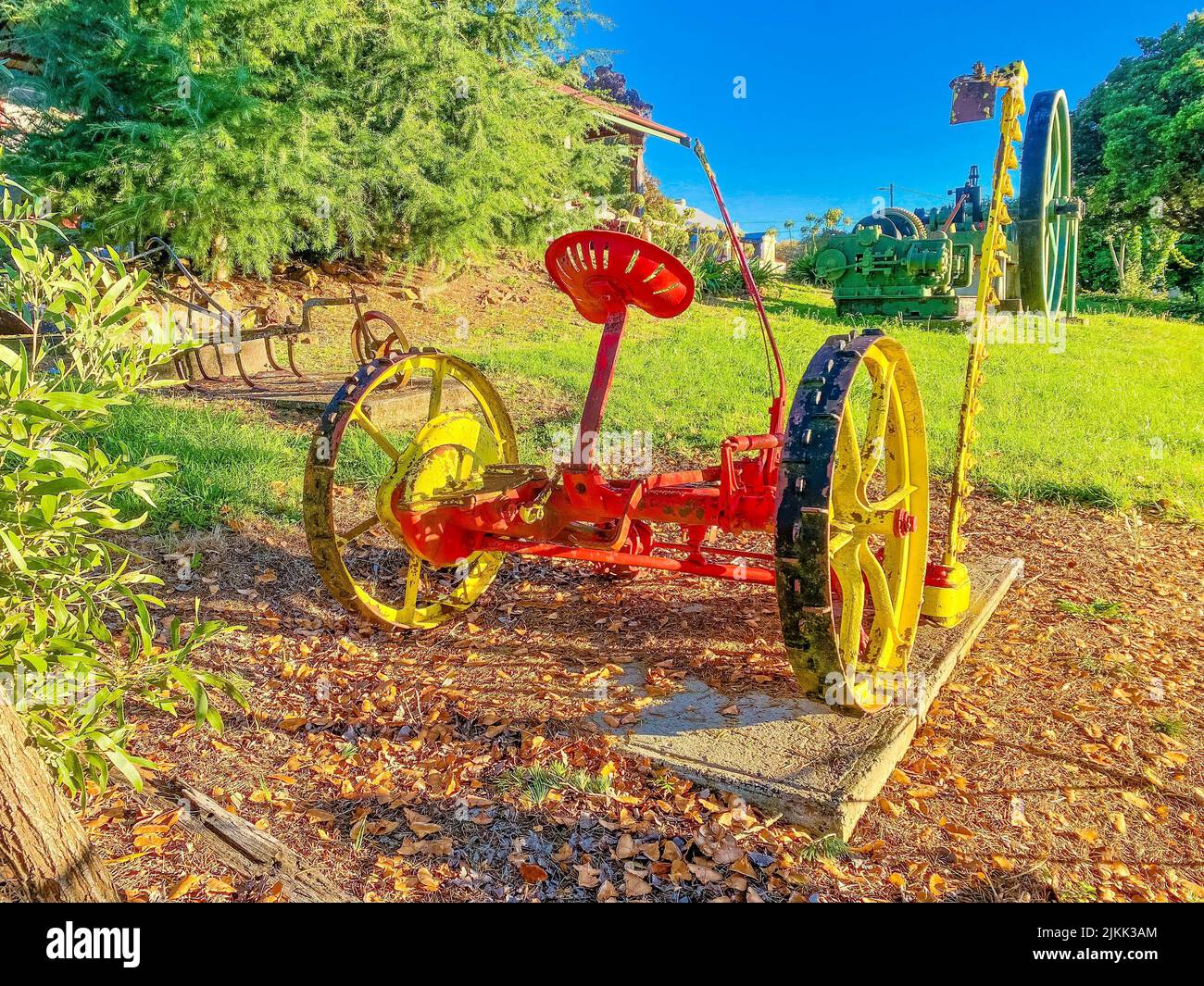 An old farming machinery display in front of the History House Museum ...