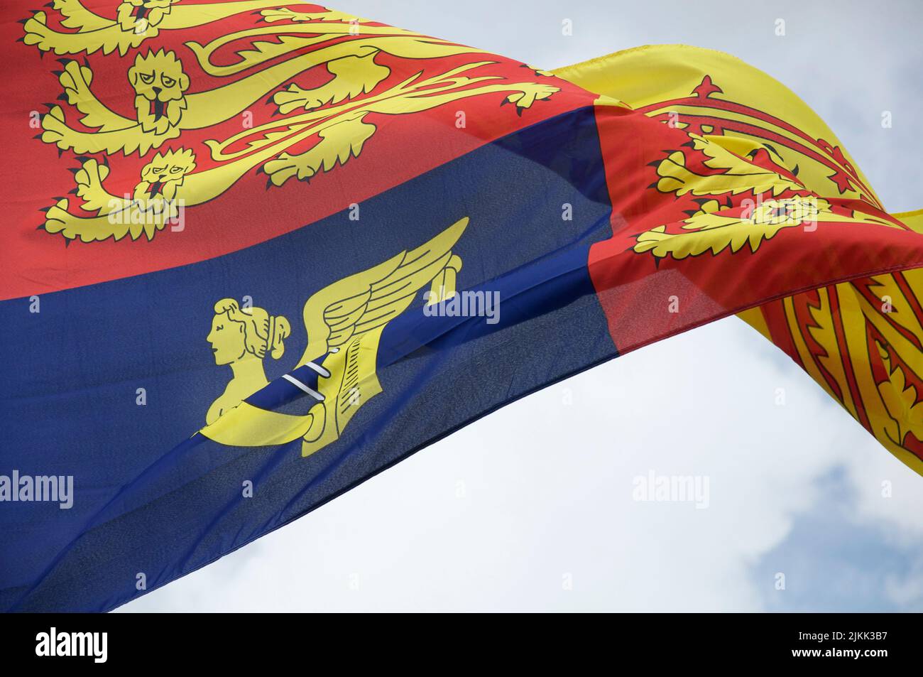 Heraldic flag. The Royal Standard of the United Kingdom blows in the ...