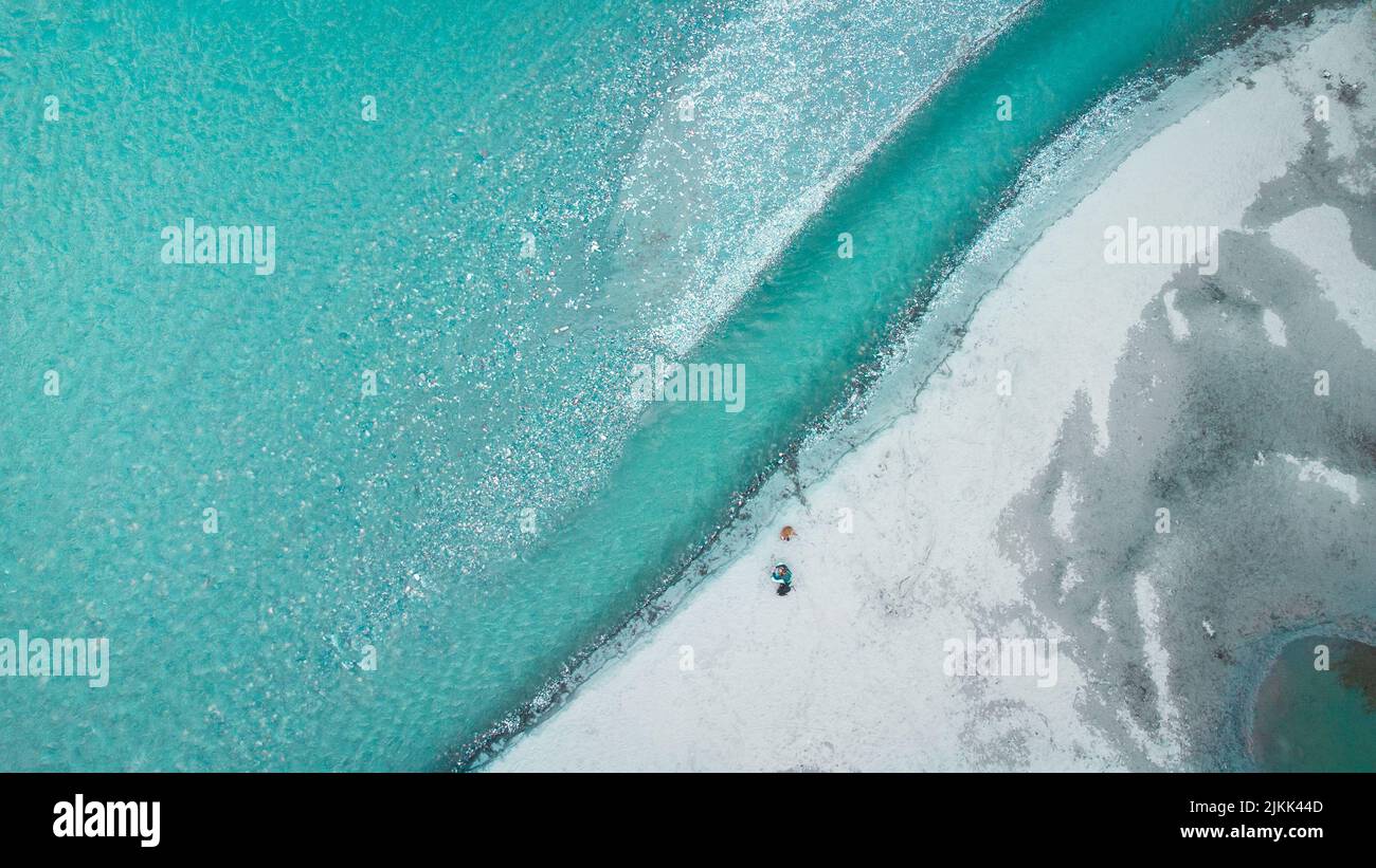 An aerial view of the turquoise sea and white sandy beach in ...