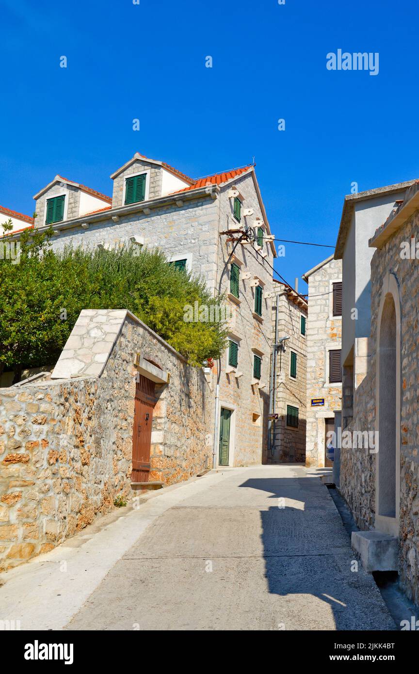 A small street in Bol, a village on an island in the Adriatic Sea ...