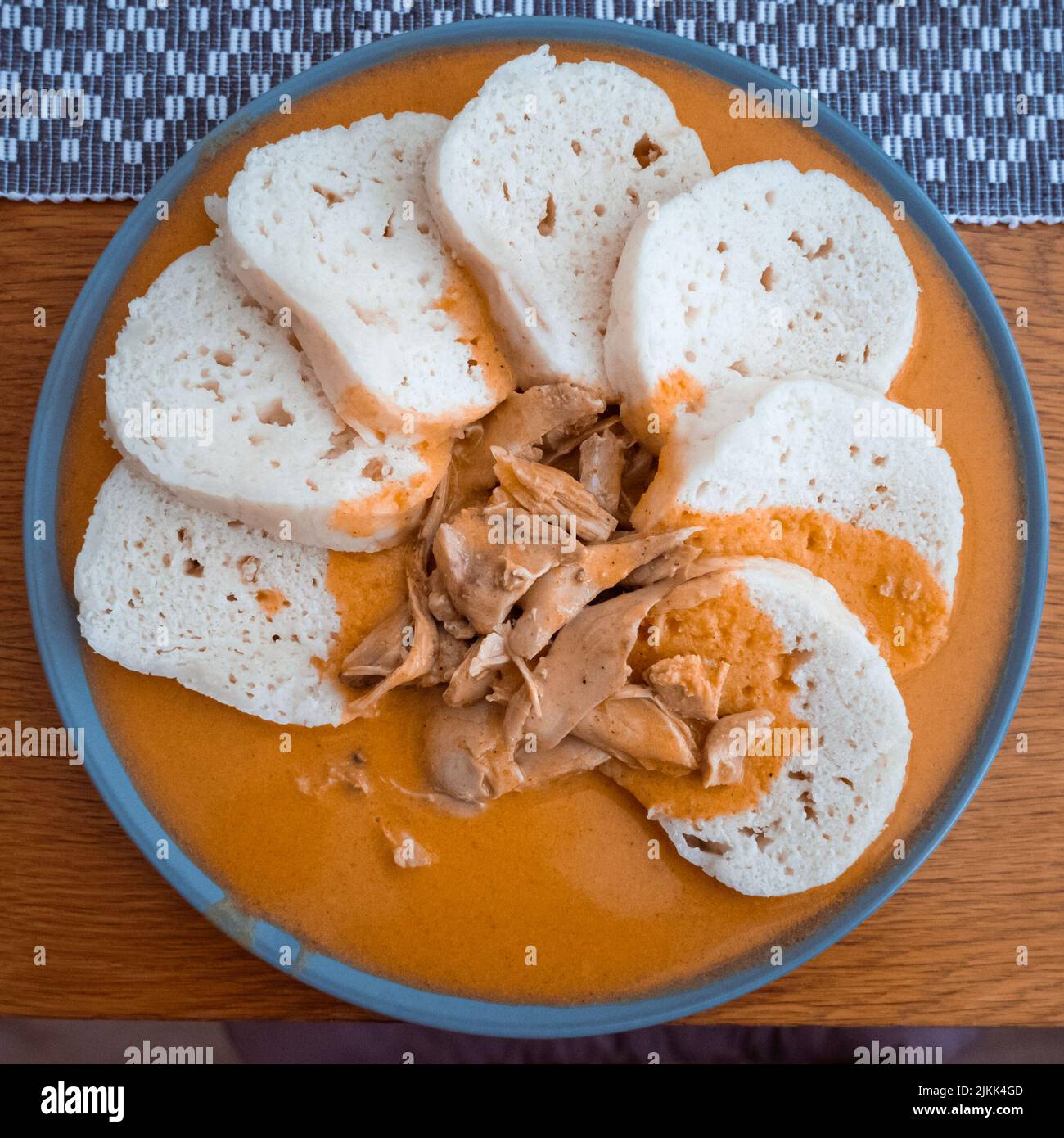 Traditional chicken hen on paprika or paprica creamy sauce with bread ...