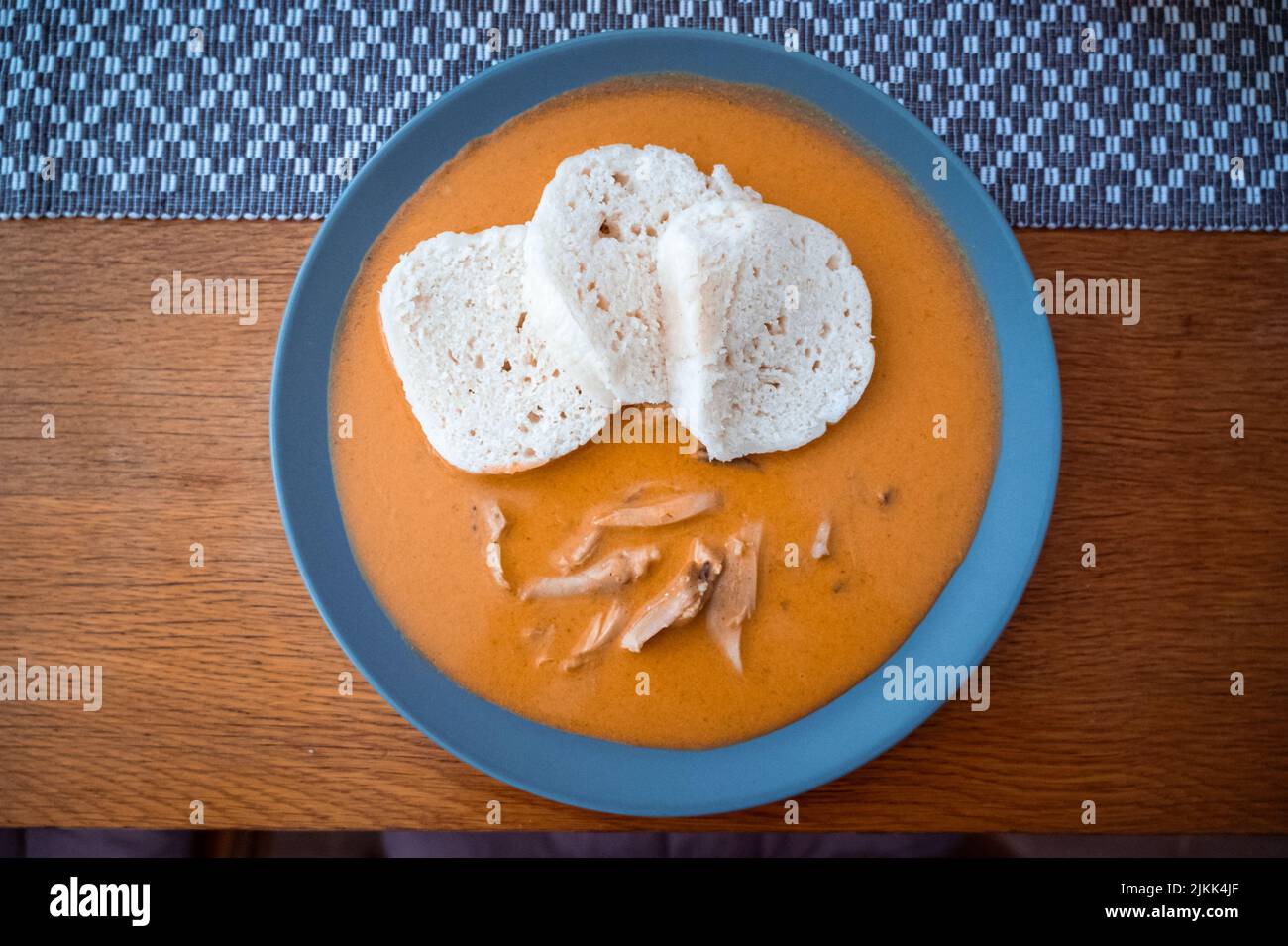 Traditional chicken hen on paprika or paprica creamy sauce with bread ...