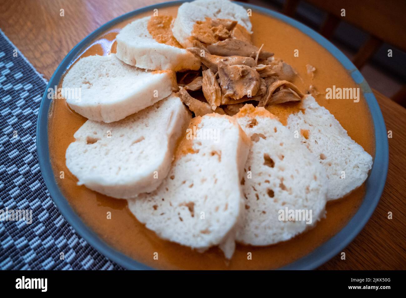Traditional chicken hen on paprika or paprica creamy sauce with bread ...