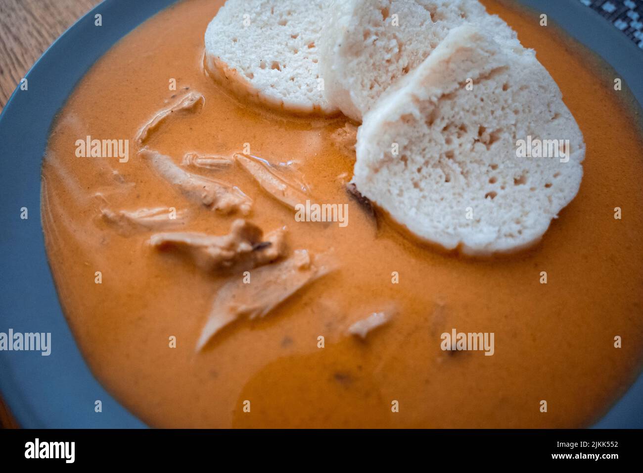 Traditional chicken hen on paprika or paprica creamy sauce with bread ...