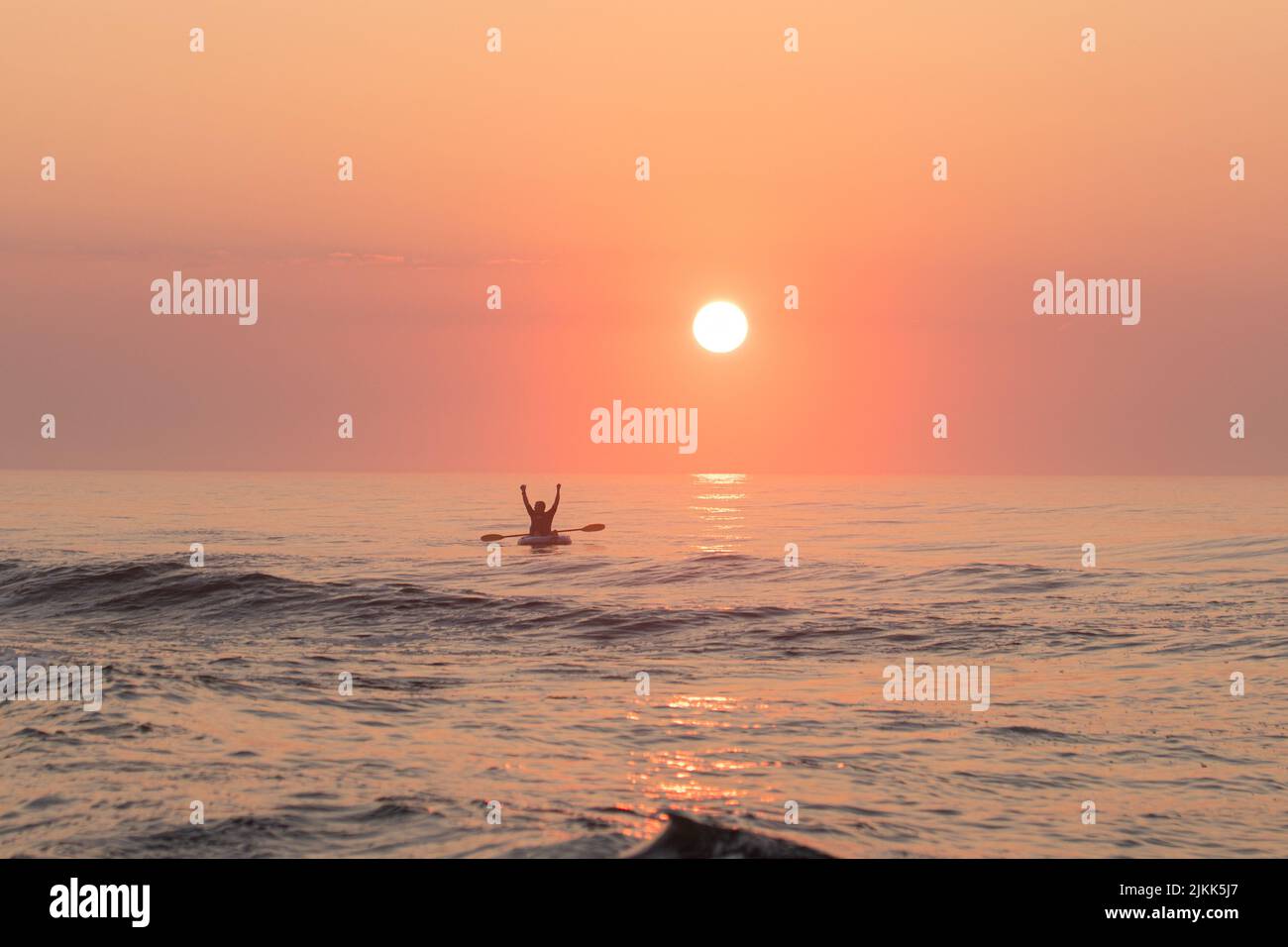 Sunset man boat hi-res stock photography and images - Alamy