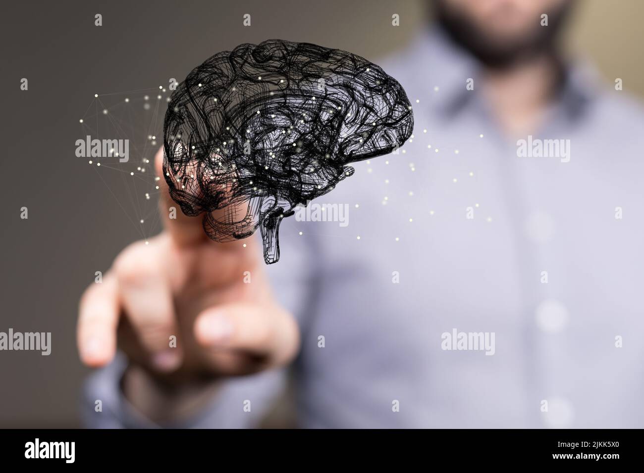 A hand touching a 3d illustration of the human brain - the concept of ...