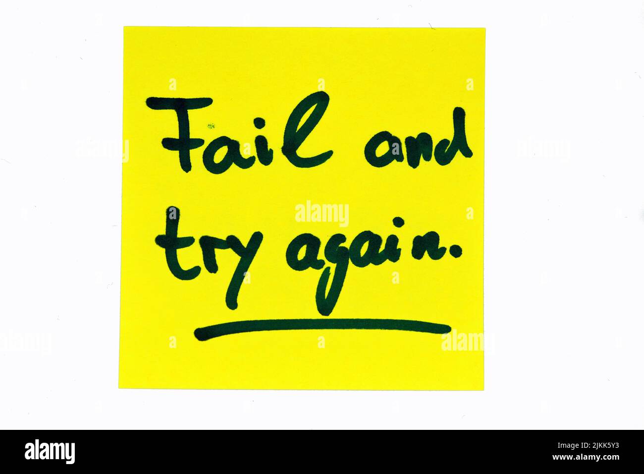 A black colored inspirational motivating quote on a yellow post-it ...