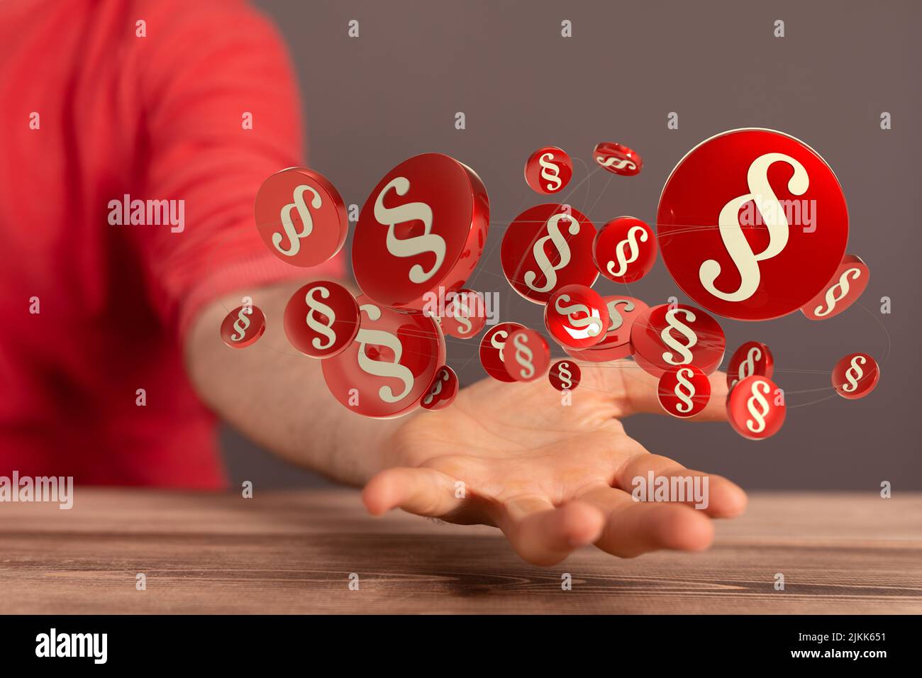A 3D rendering of red section signs hovering over a person's palm - law and justice concept ...