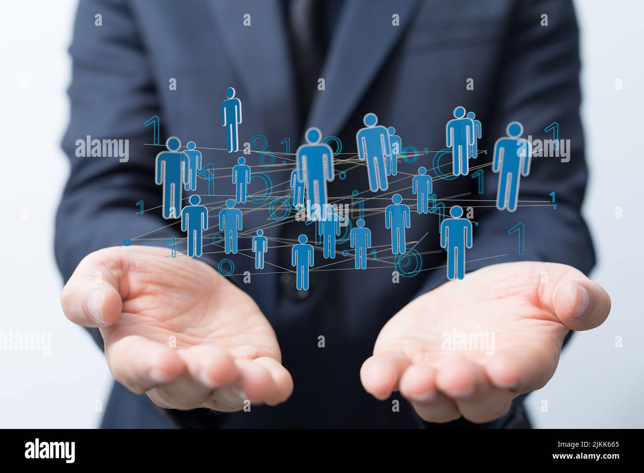 A group of 3D rendered people icons hovering over a man's hands Stock ...