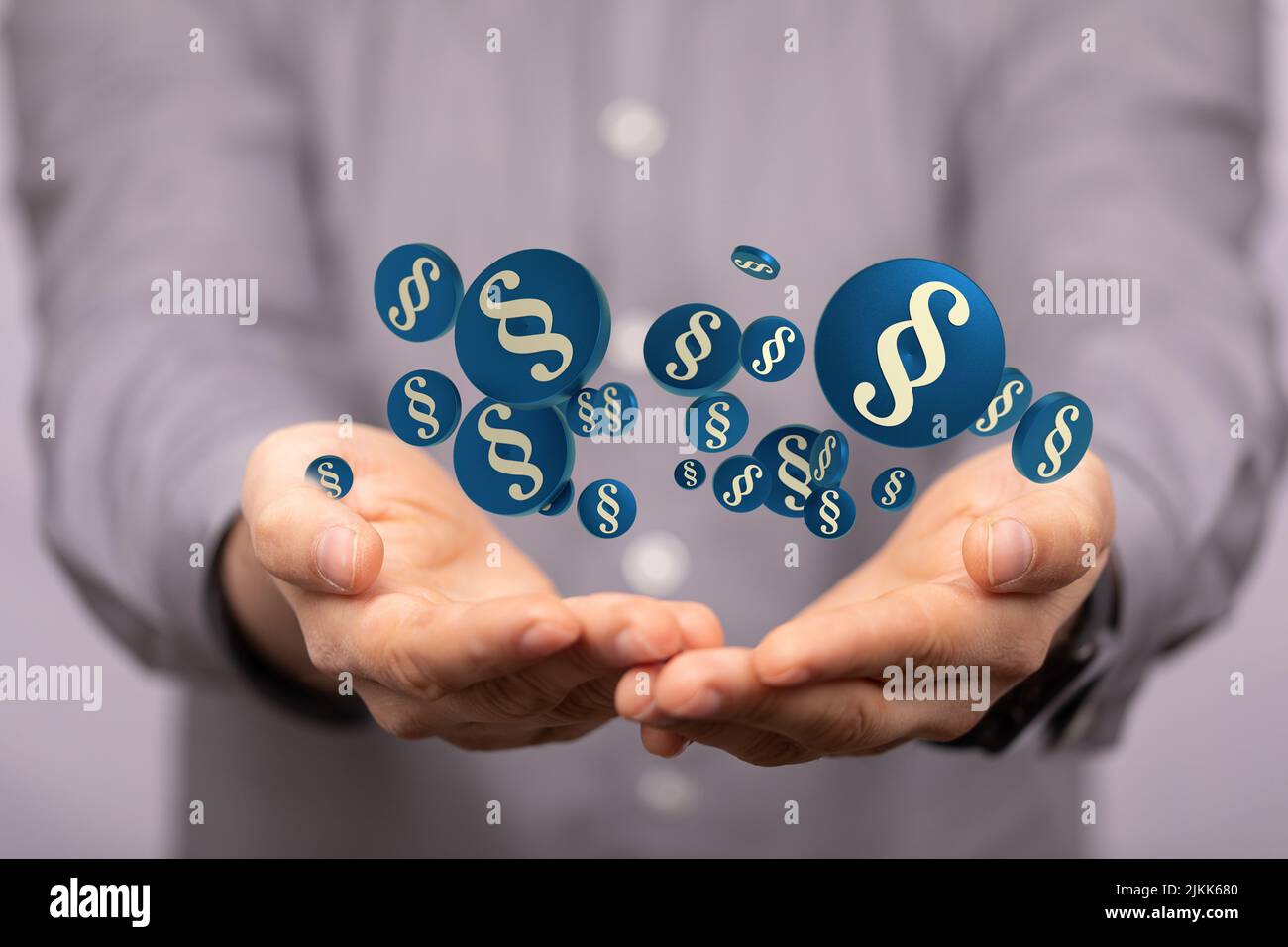 A 3D rendering of blue section signs hovering over a person's palms - law and justice concept ...