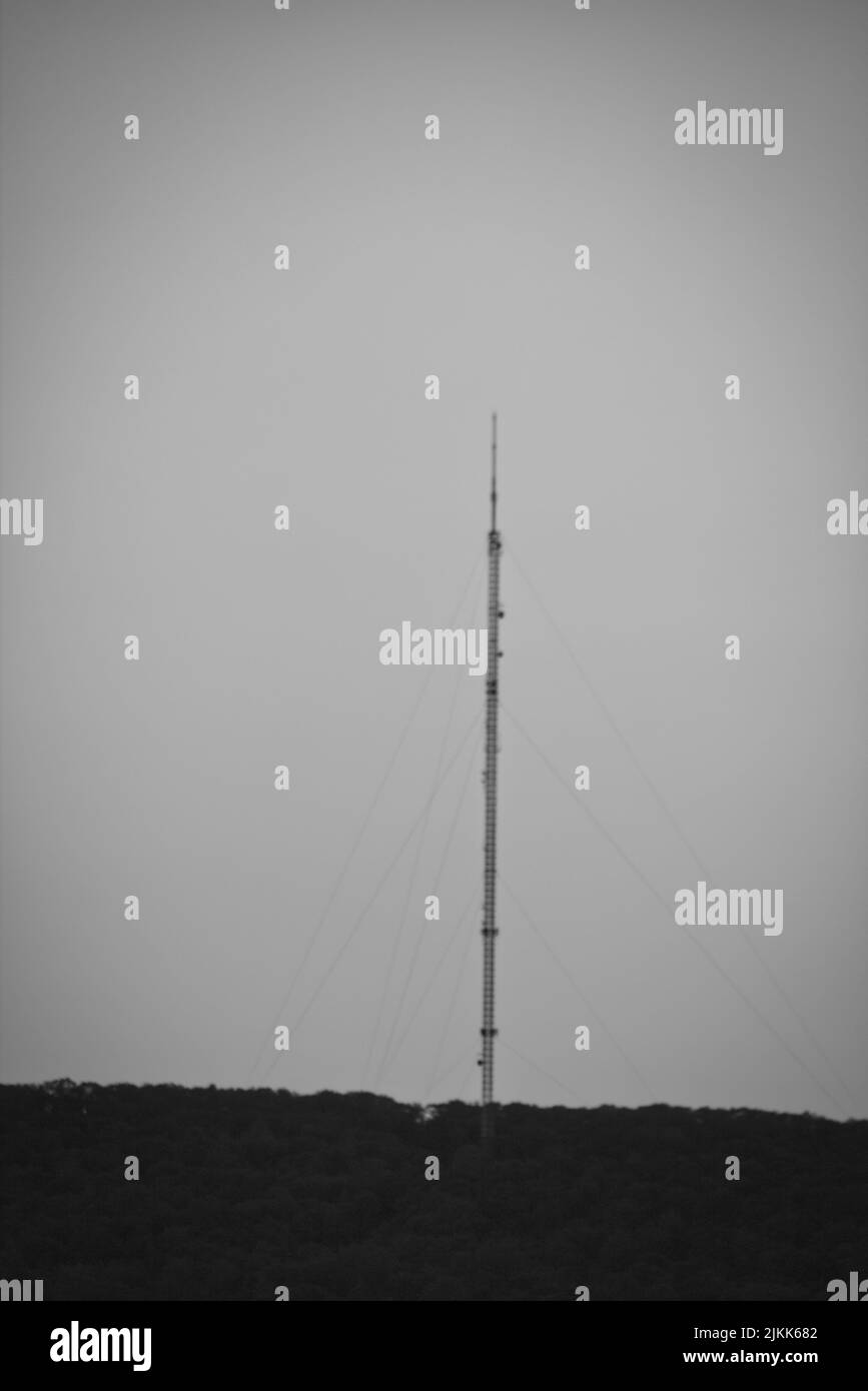 A vertical shot of an electric power line in a field Stock Photo - Alamy