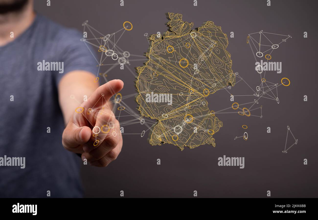 A man tapping on a 3D rendering of a Germany map - internet, and global ...