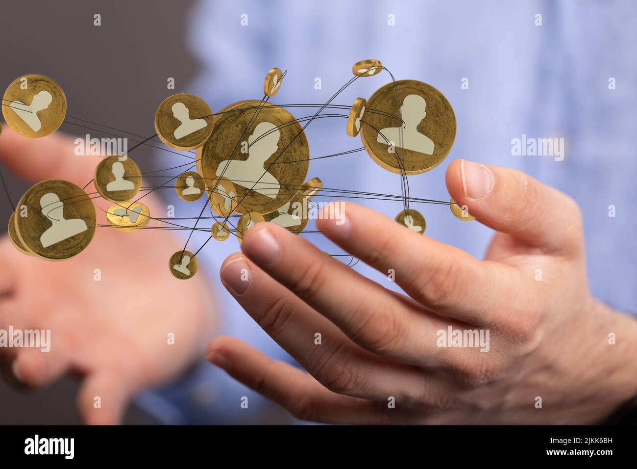 A 3D rendering of golden people icons hovering over a man's hand Stock ...