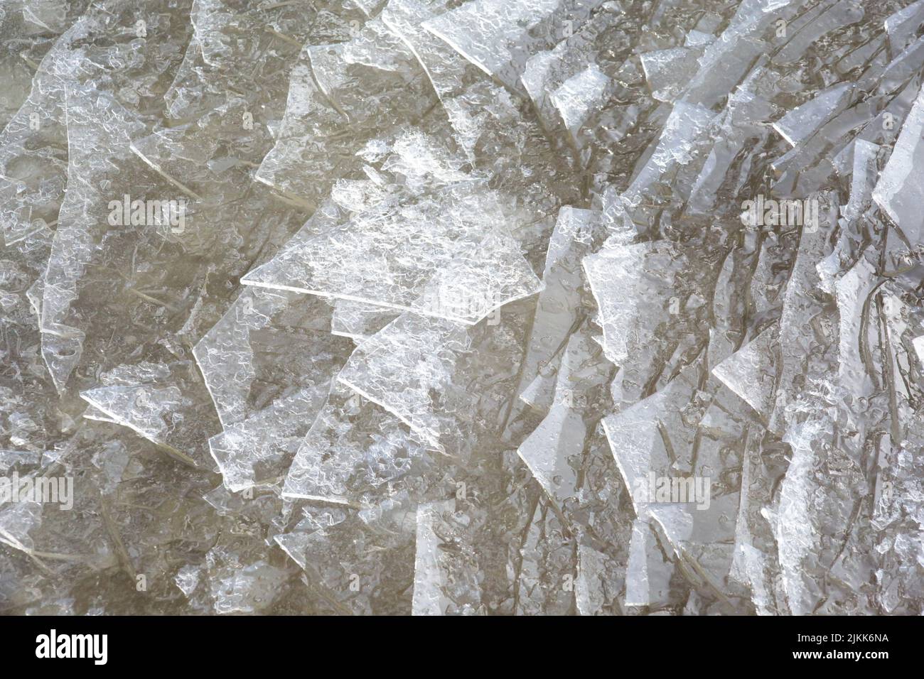 Broken ice shards on the water surface Stock Photo - Alamy