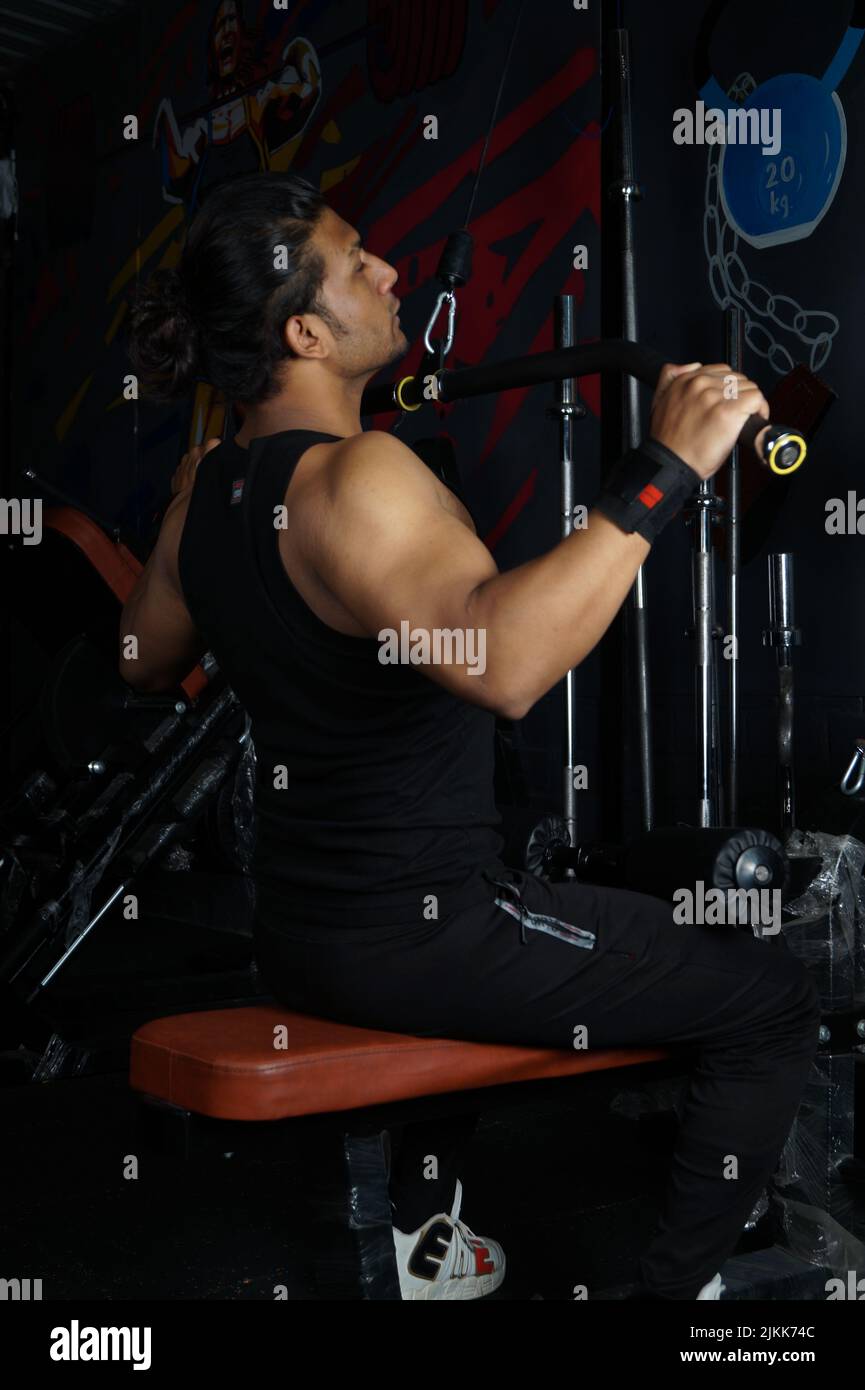 Strong man exercising gym muscular sport hi-res stock photography and ...