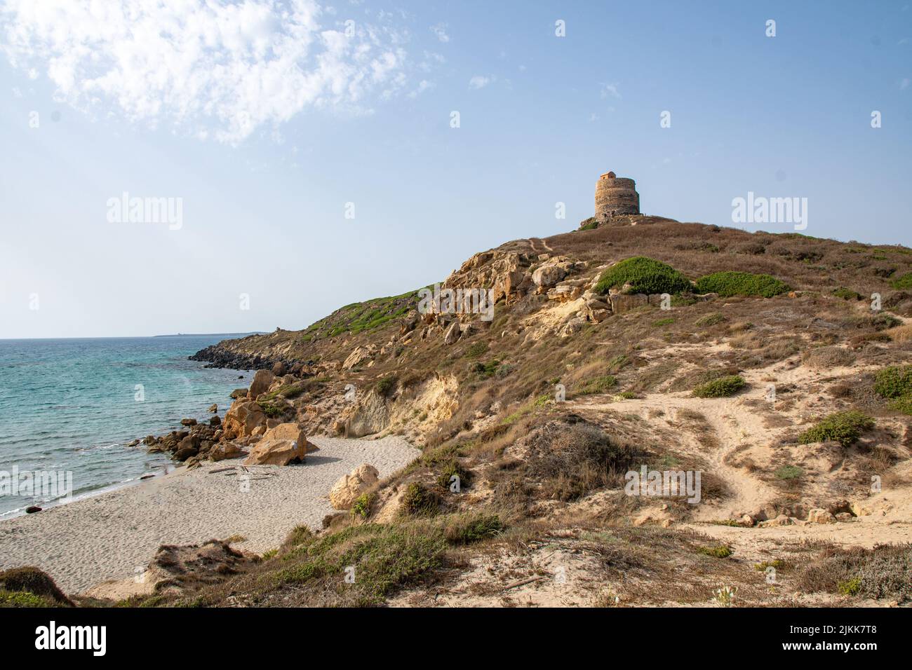 a shot of small building on hill against sea Stock Photo - Alamy