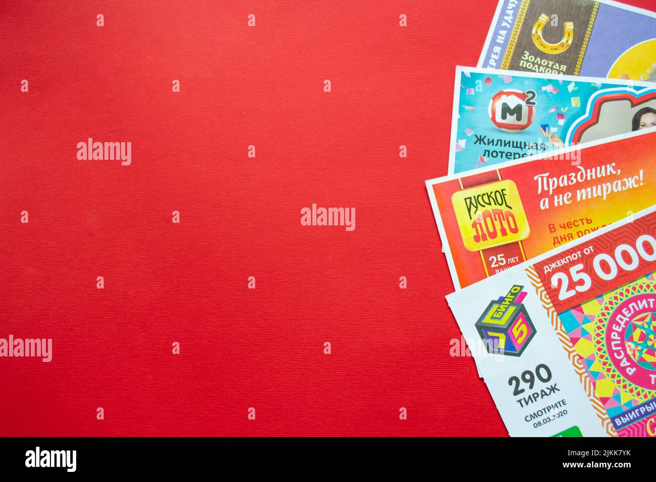 Moscow, Russia, July 2020: Various Russian lottery tickets on a red ...