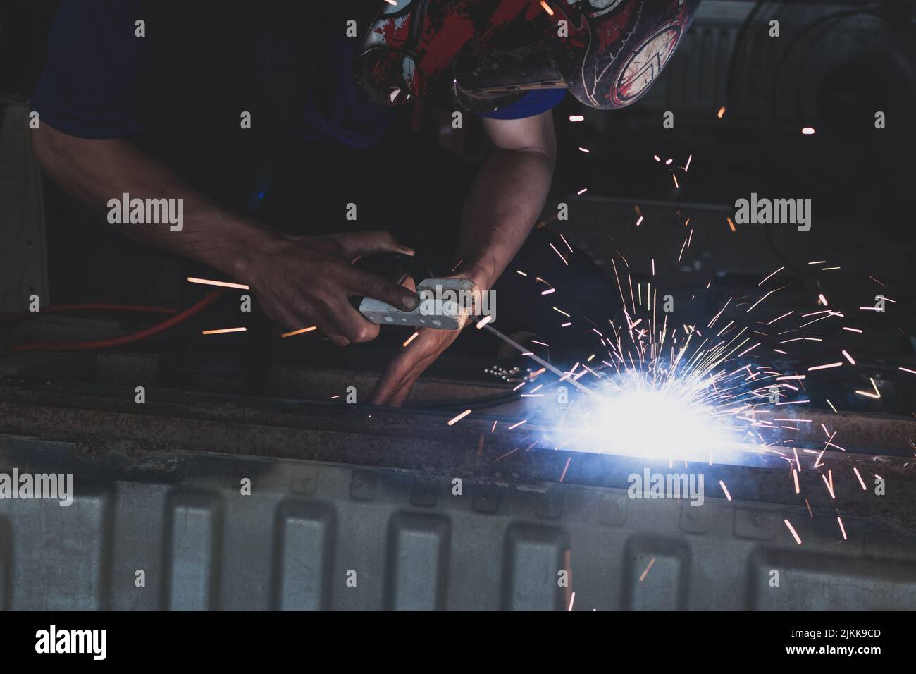 A welder welding automotive part in a car factory Stock Photo - Alamy