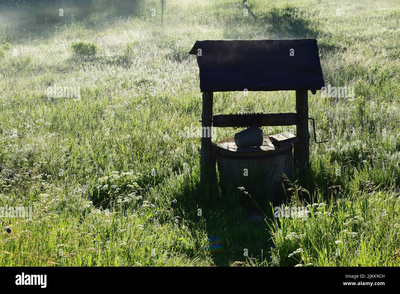 An old well in the middle of rural field Stock Photo - Alamy