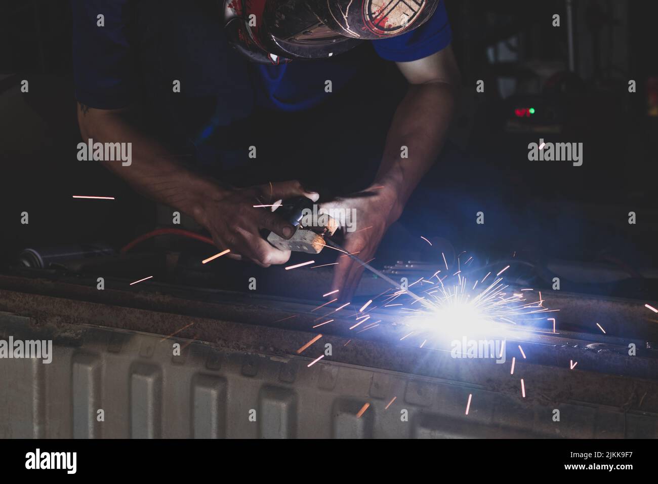 A welder welding automotive part in a car factory Stock Photo - Alamy