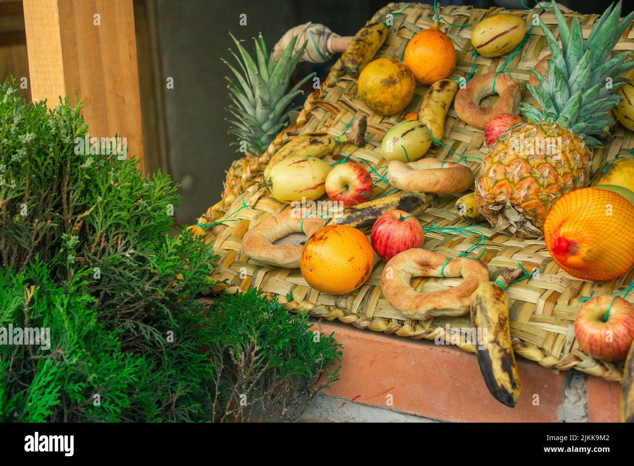 A Shallow focus of fruits on a straw surface Stock Photo - Alamy
