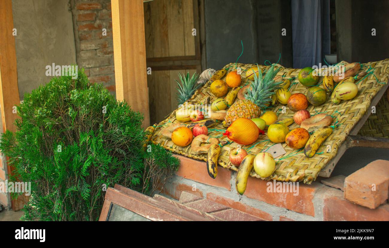A Shallow focus of fruits on a straw surface Stock Photo - Alamy
