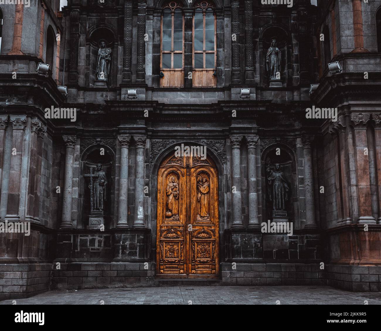 A frontal shot of the facade entrance of an ancient wall and a door ...