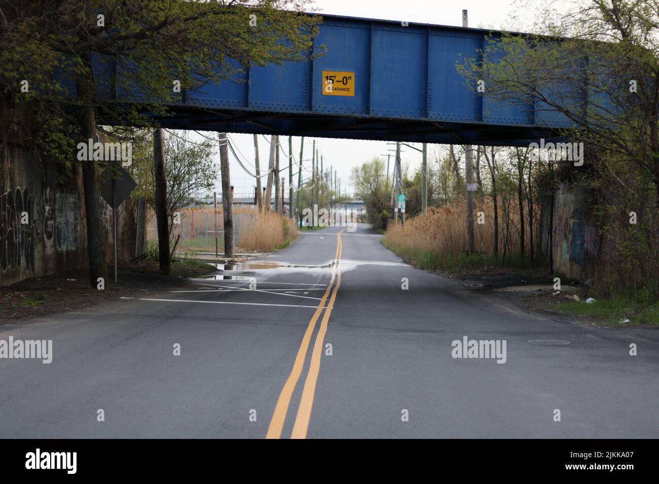 A blue viaduct bridge over a road Stock Photo - Alamy