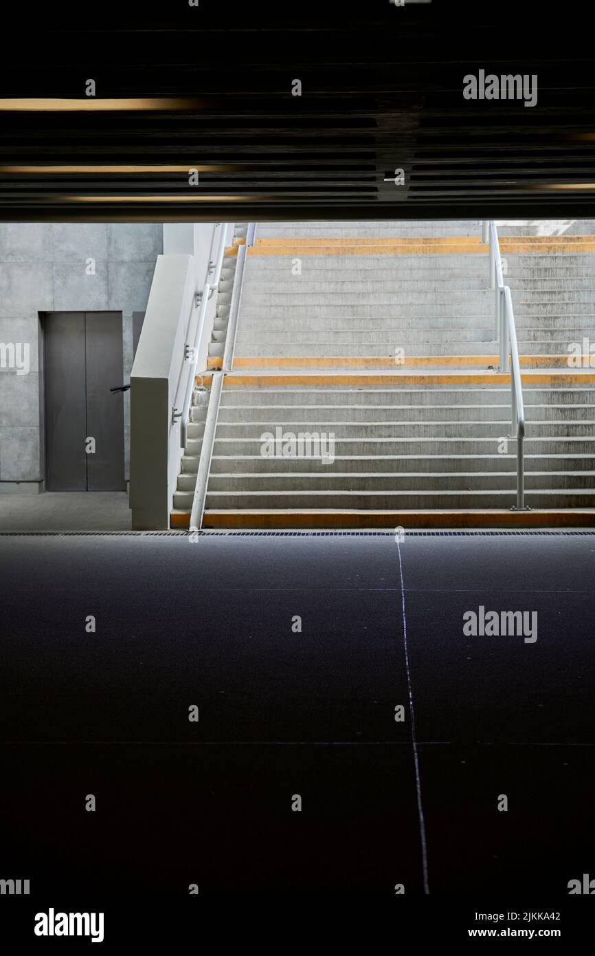 A closeup of underground stairs in the daylight Stock Photo - Alamy