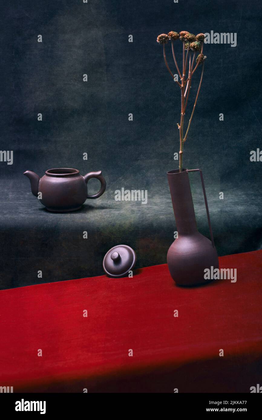 Still life with a vase of flowers and a kettle with a lid Stock Photo ...