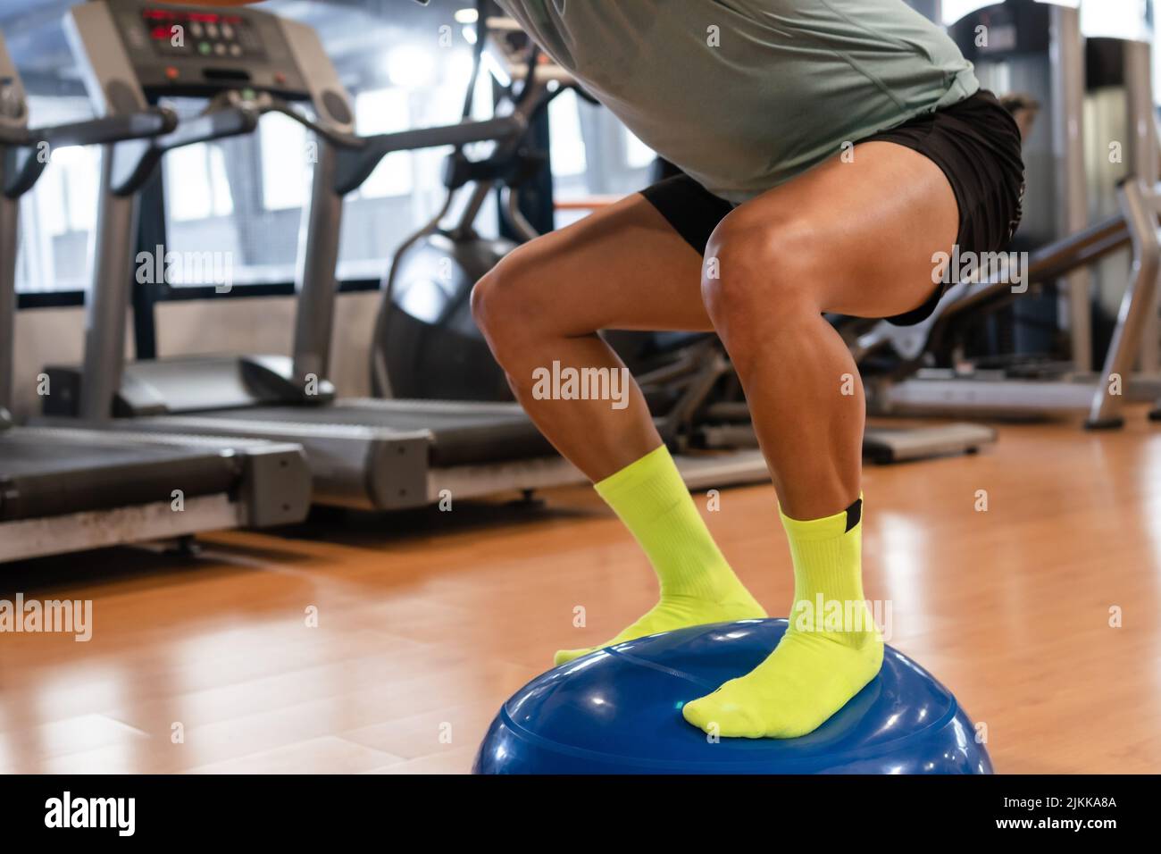 Feet of a Caucasian man in the gym doing balance exercises for the ...