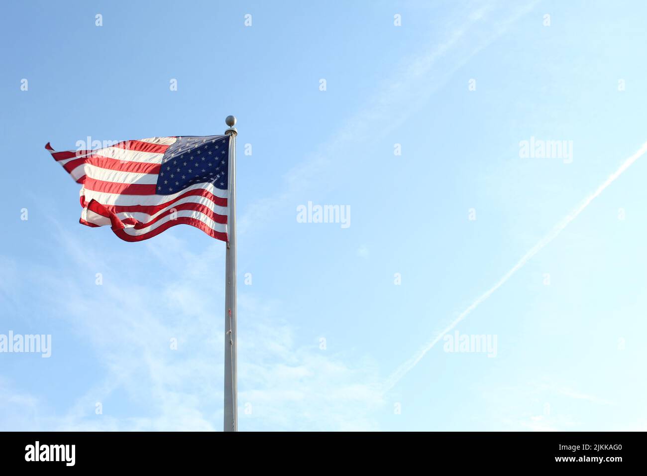 The US flag fluttering in the wind Stock Photo - Alamy
