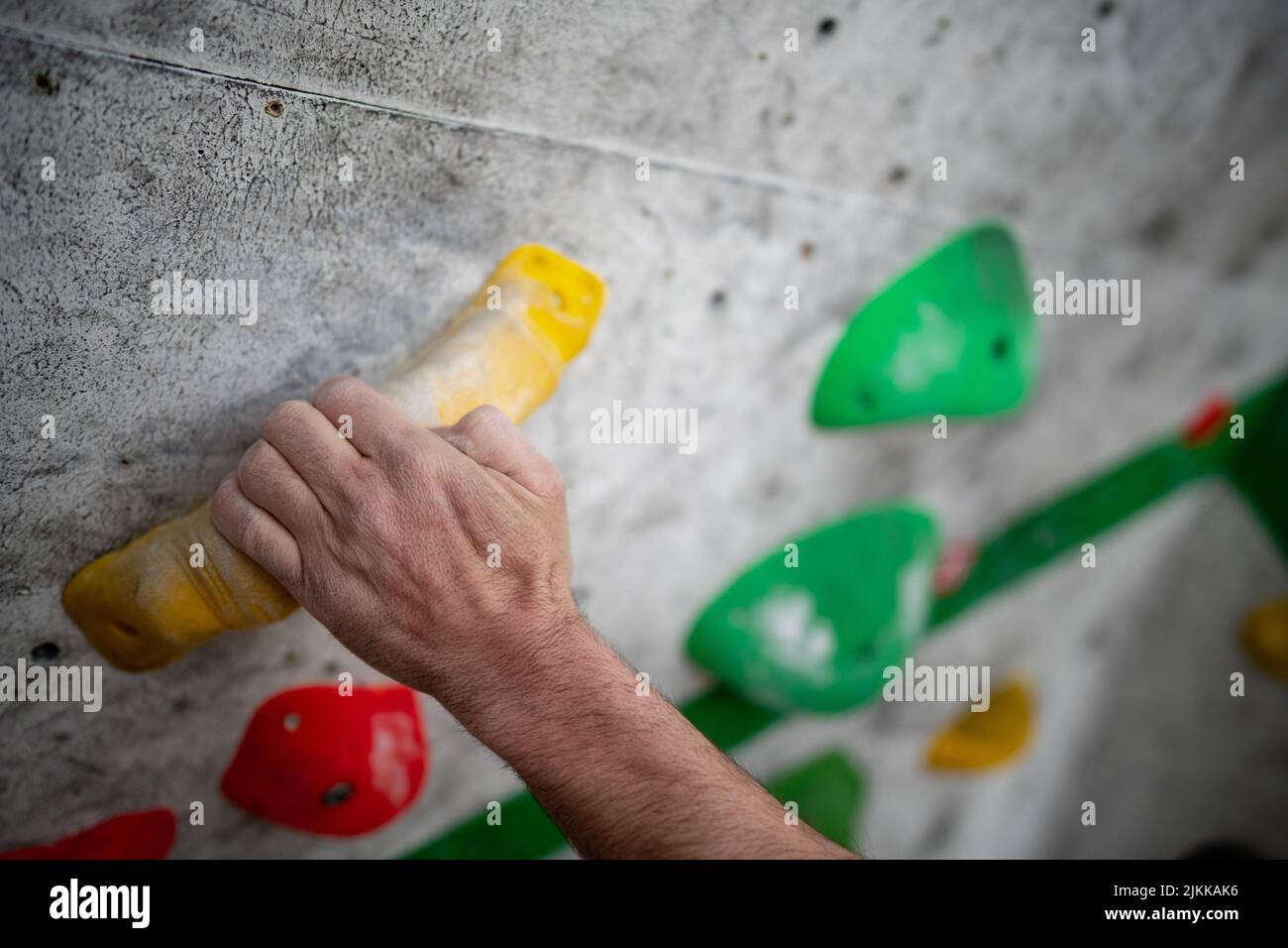 Close up shot of a male hands smeared with magnesium powder grabbing a ...