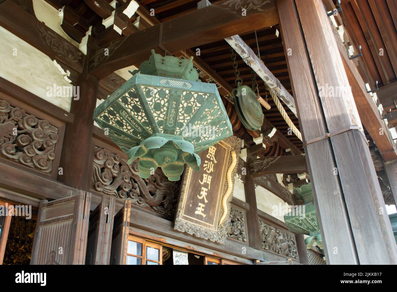 Low angle shot of ceiling with artefacts in front of temple - shrine in ...