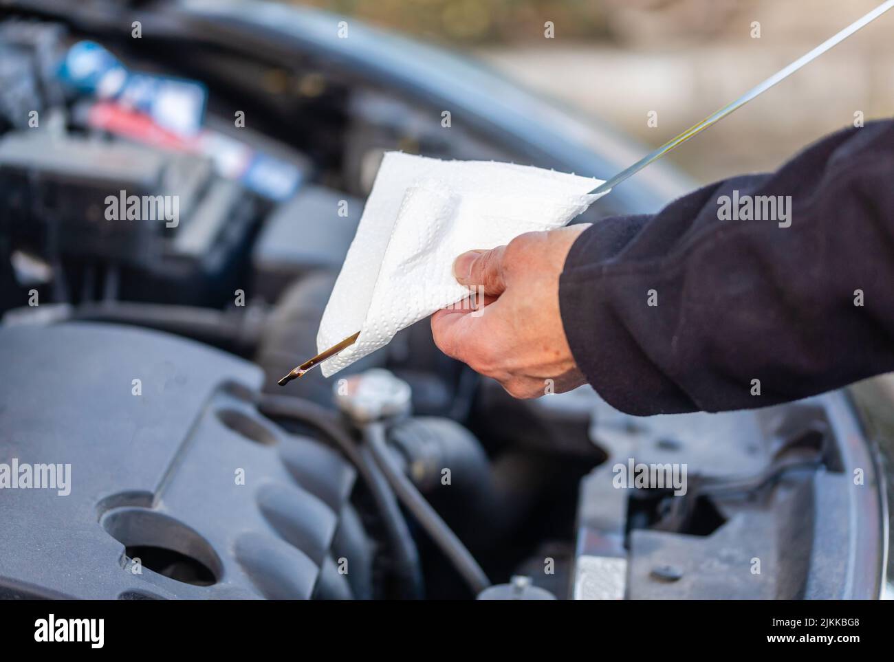 Man is checking oil level on car Stock Photo - Alamy