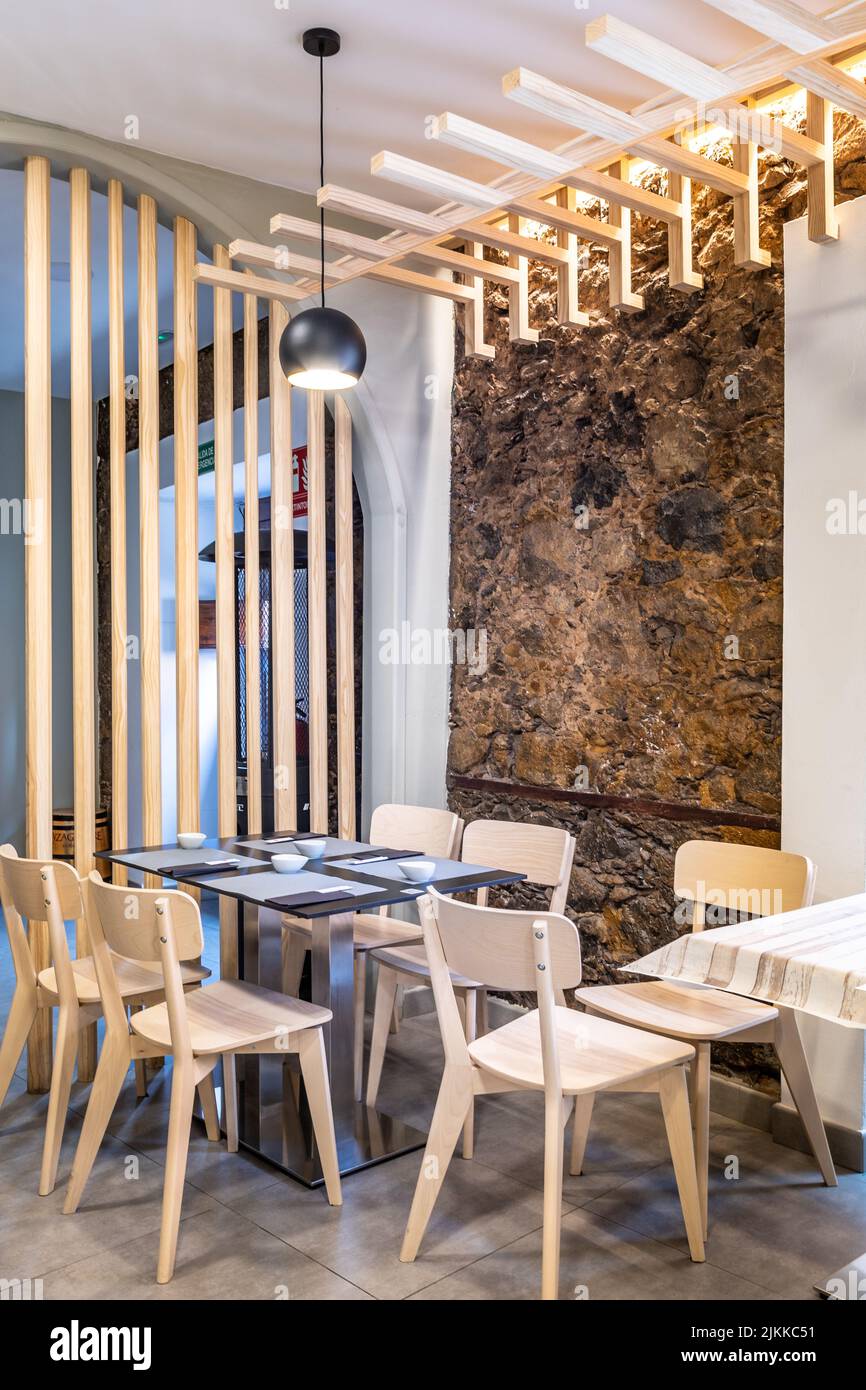 A vertical shot of an interior of a restaurant with contemporary design ...