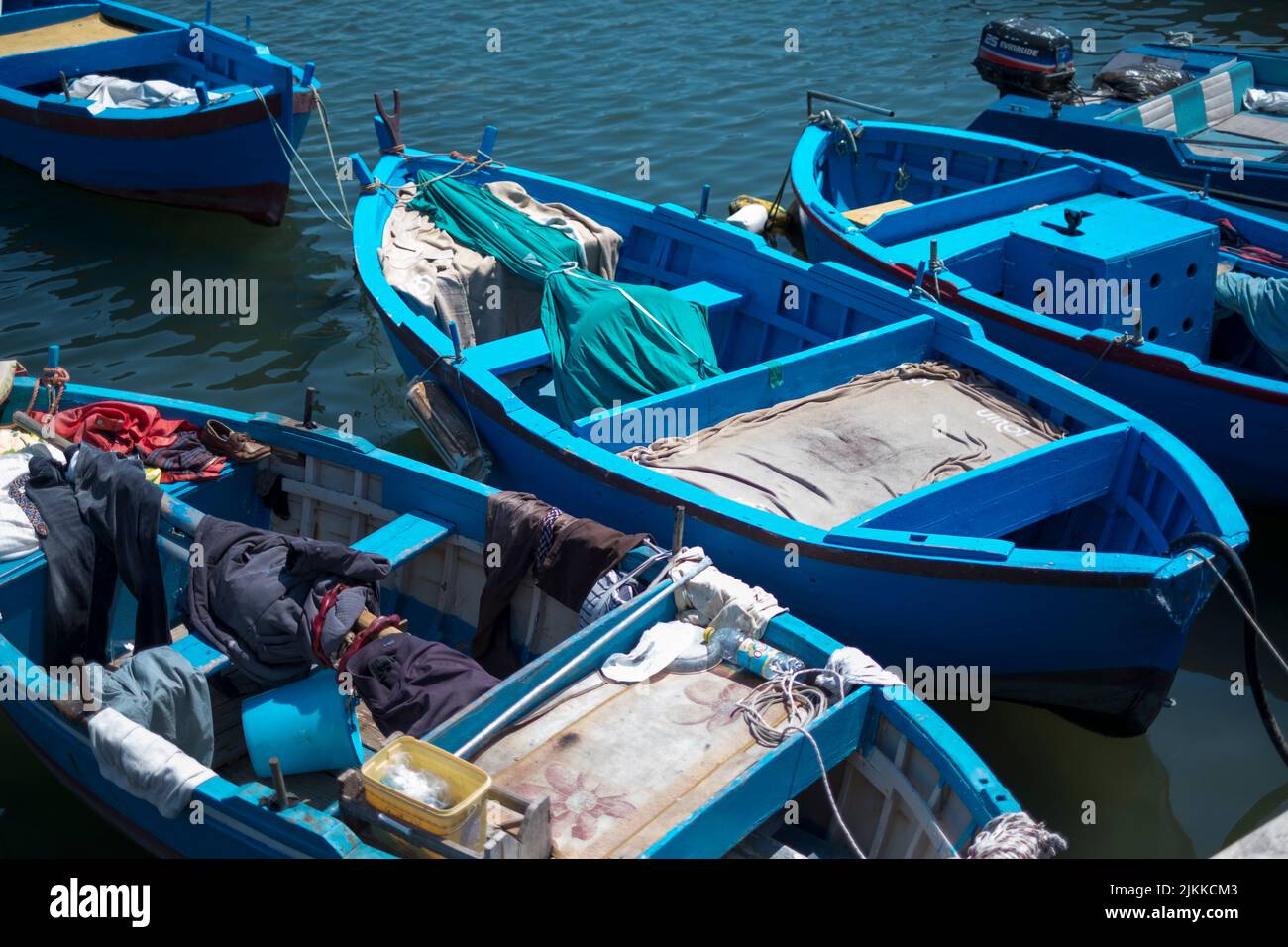 The blue fishing boats parked near the port in Morocco Stock Photo - Alamy