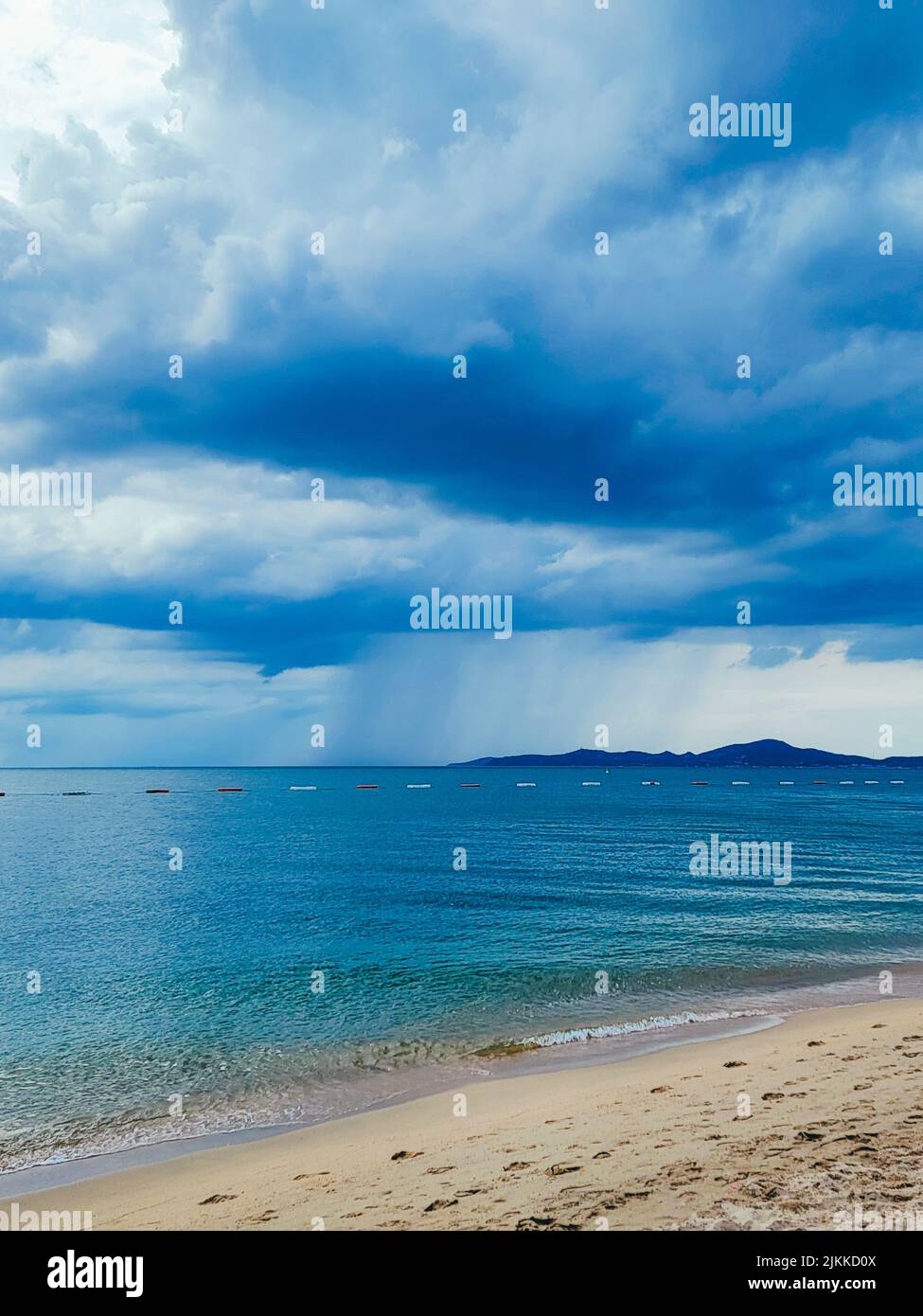 a vertical shot of a beautiful ocean and the clouds Stock Photo - Alamy