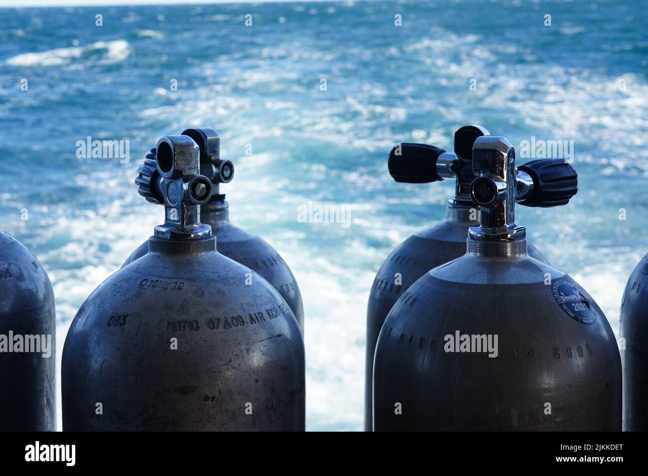 a close up shot of Scuba diving tank and the water as a background ...