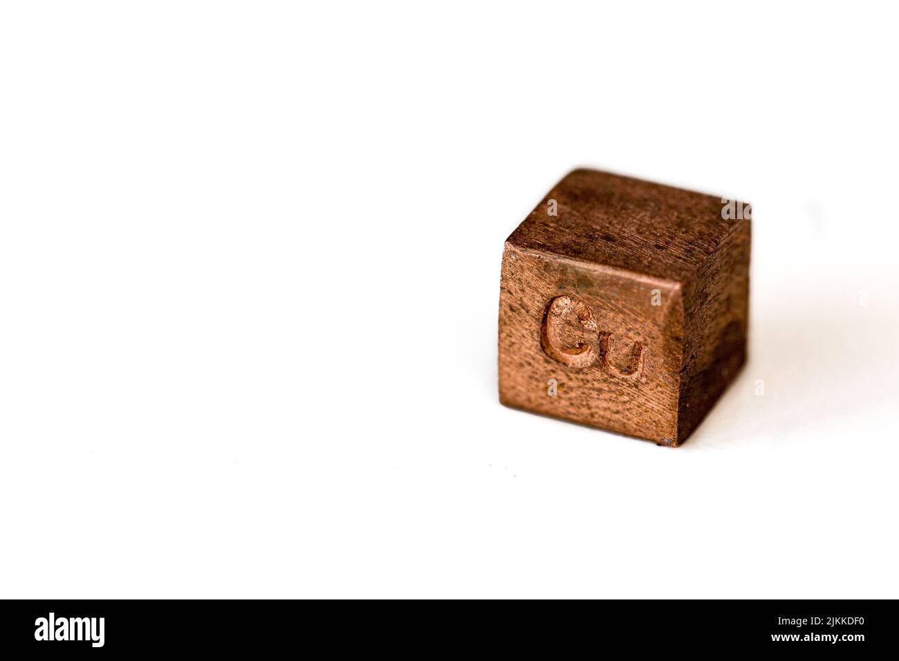 Copper cube with element name Cu on it on white background Stock Photo ...