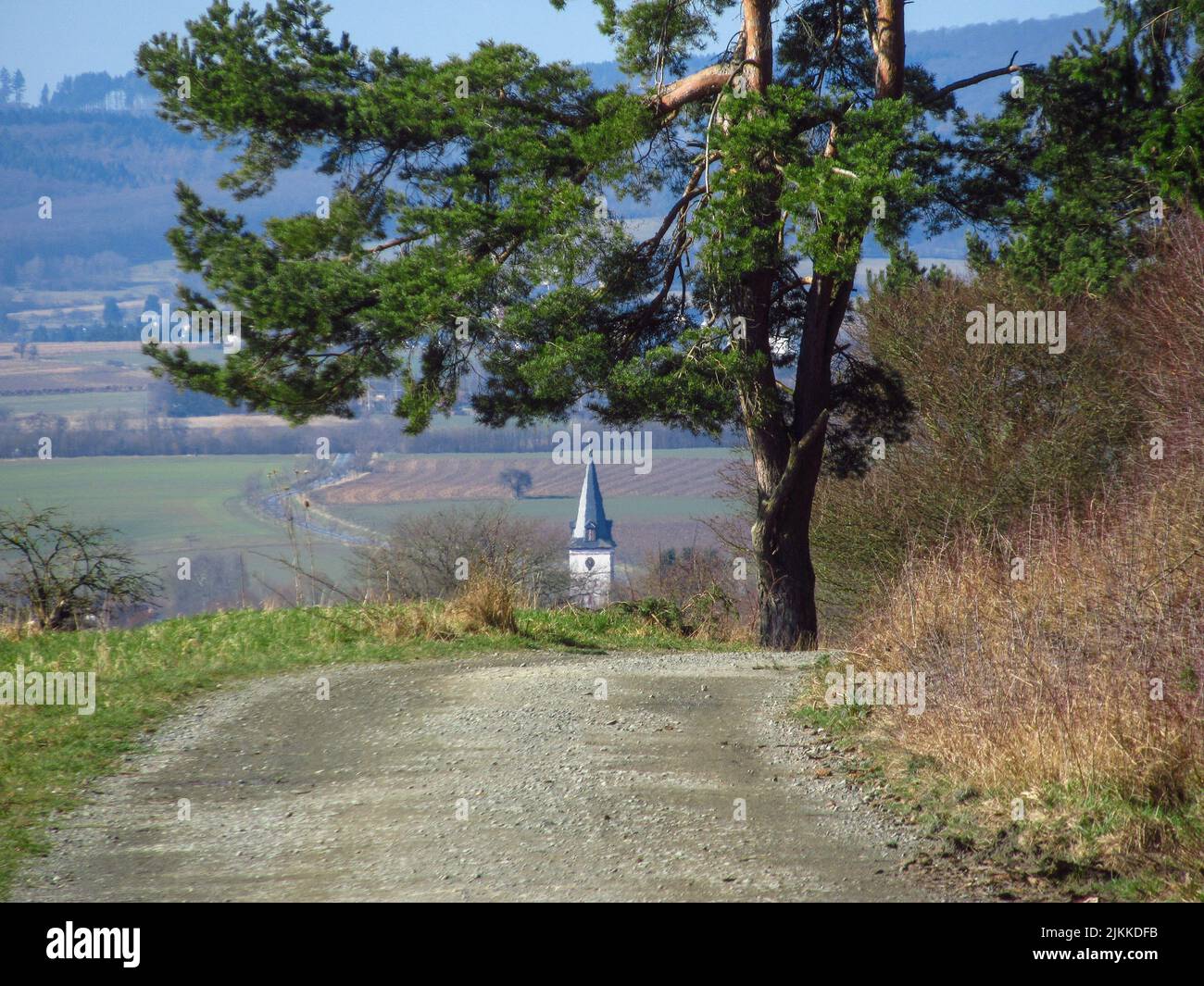 A pathway in a country area with a tower seen in the distance Stock ...