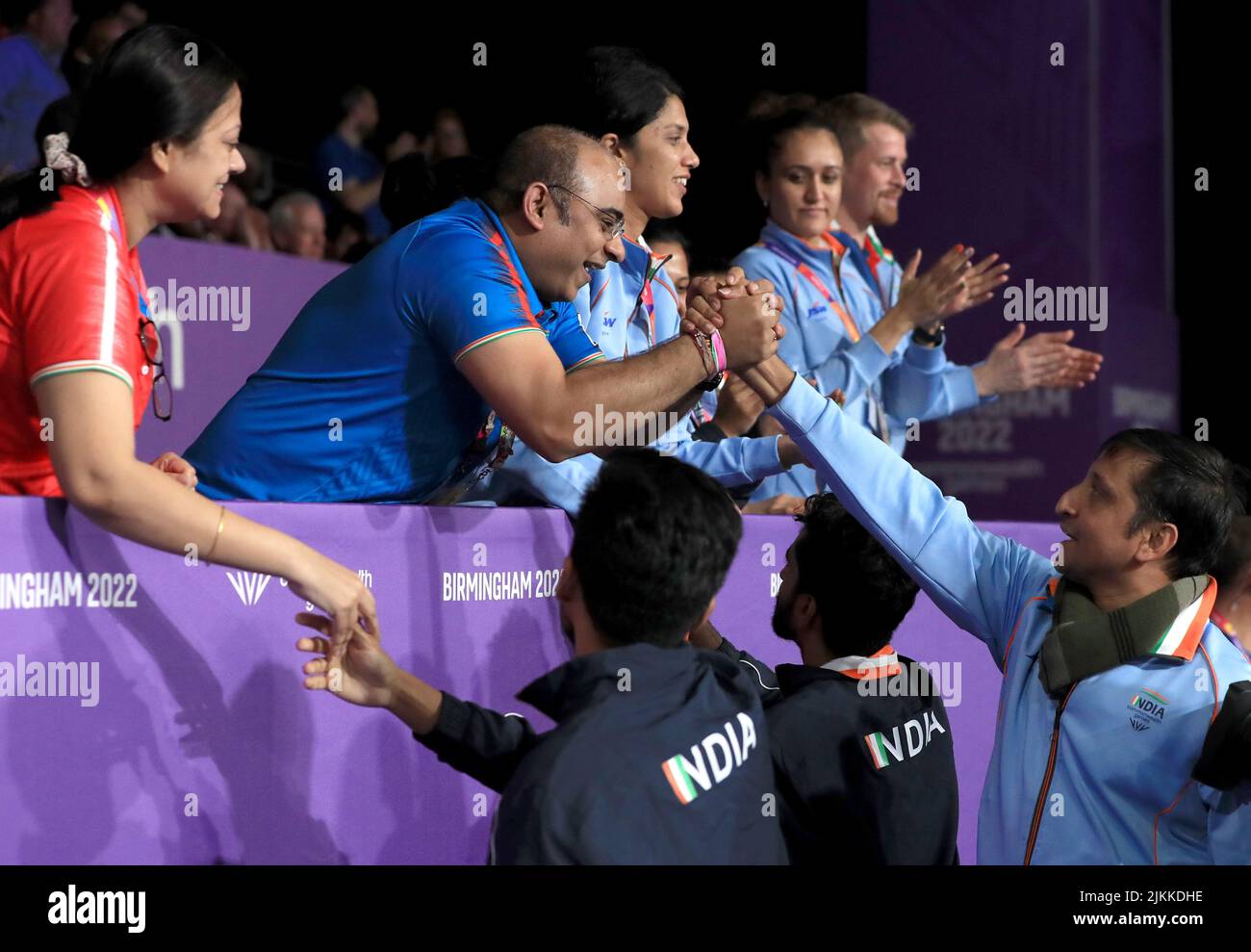 Team India is congratulated by their coaches after winning Gold in the Men’s Team Table Tennis ...
