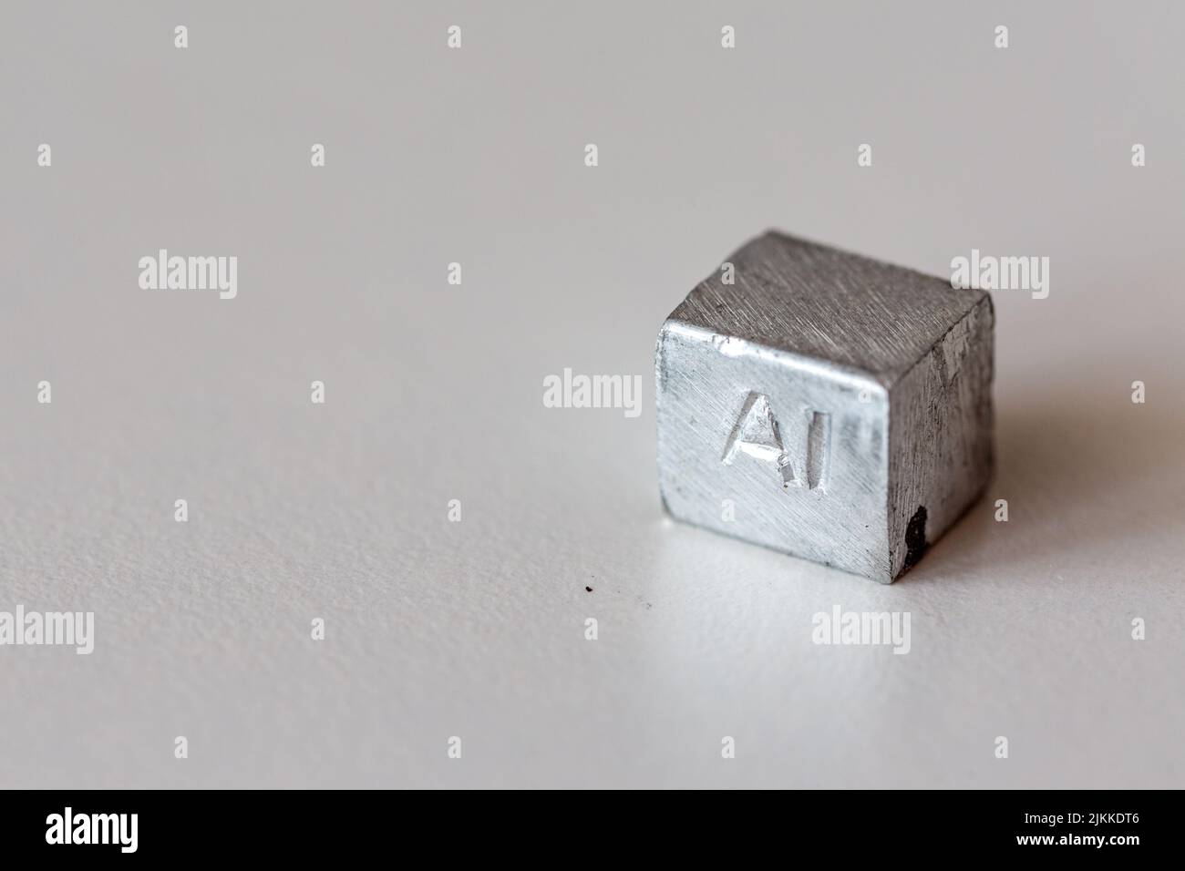 Aluminium cube with element name Al on it on cream background Stock ...