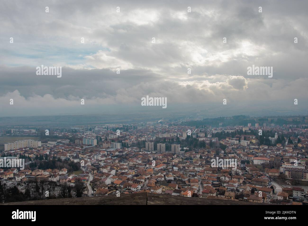 A bird's eye view of Razlog cityscape under a cloudy sky in Blagoevgrad ...