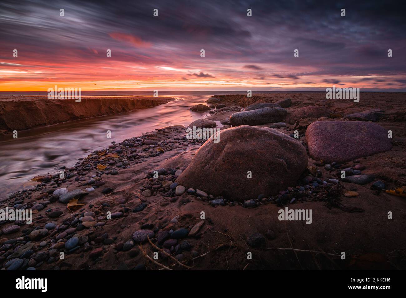 Sunset with rocks and sand hi-res stock photography and images - Alamy